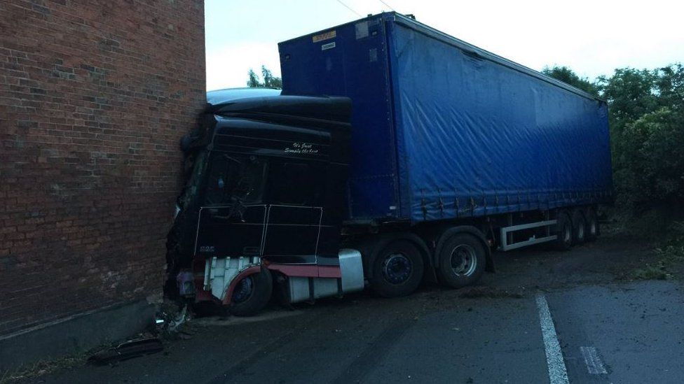Lorry smashes into house by field near Hinstock - BBC News