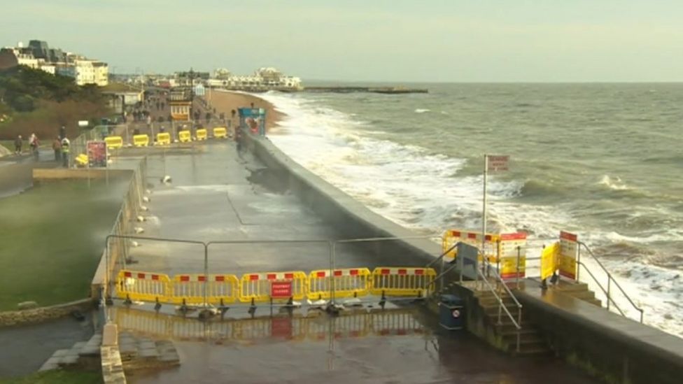 Southsea promenade flood defence wall collapses into sea - BBC News