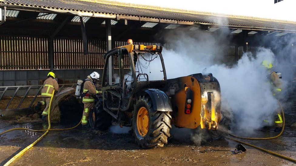 Cows rescued after JCB fire near Isle of Man farm's barn - BBC News