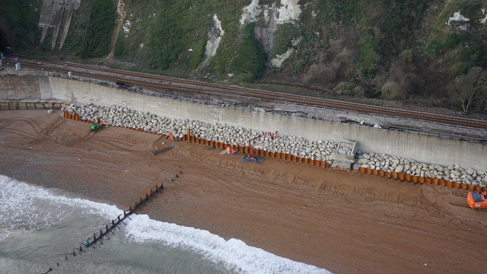 Dover rail line reopens after sea wall collapse - BBC News
