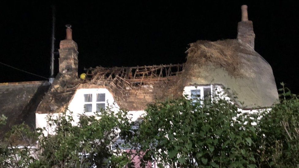 Crews tackle thatched roof fire and large heath blaze - BBC News