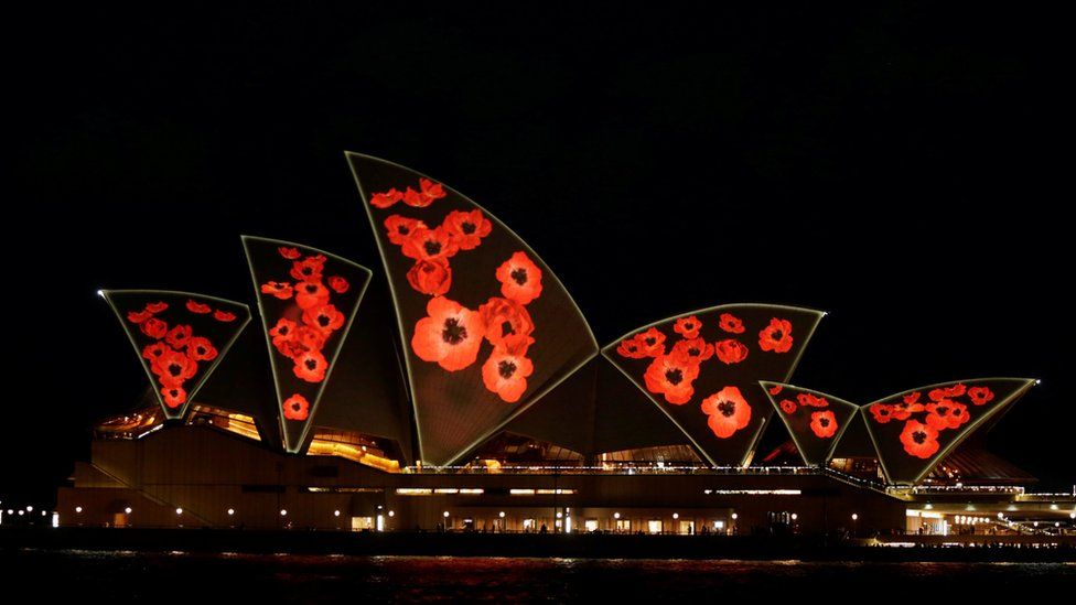 Armistice Day 2016: Sydney Opera House lit up with red poppies - BBC News