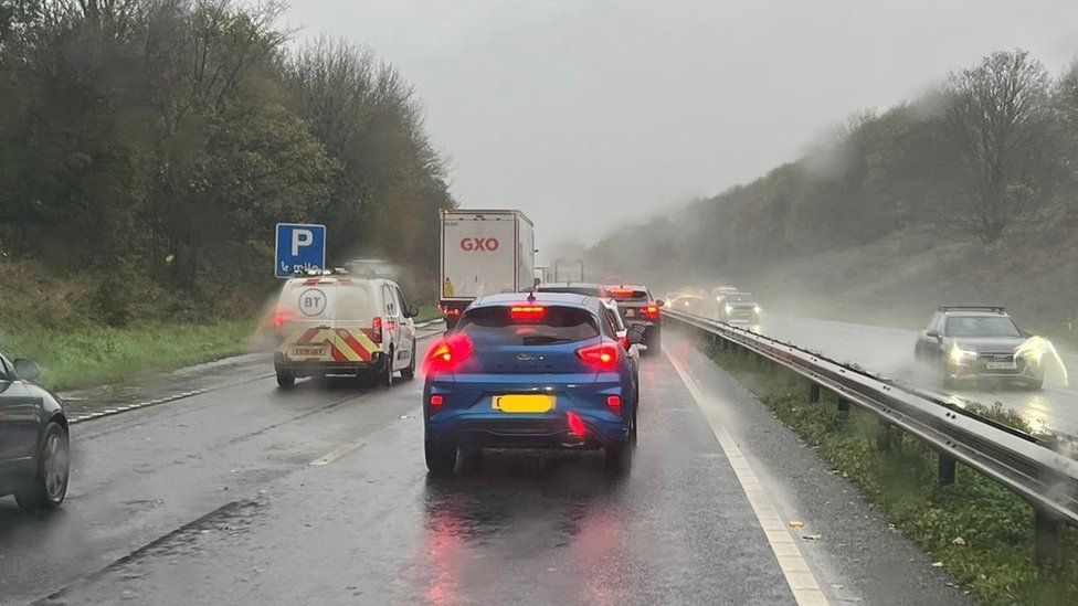 Strong wind and rain cause travel disruption - BBC News
