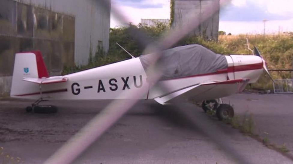 'Impounded' aircraft flies out of former Plymouth airport - BBC News