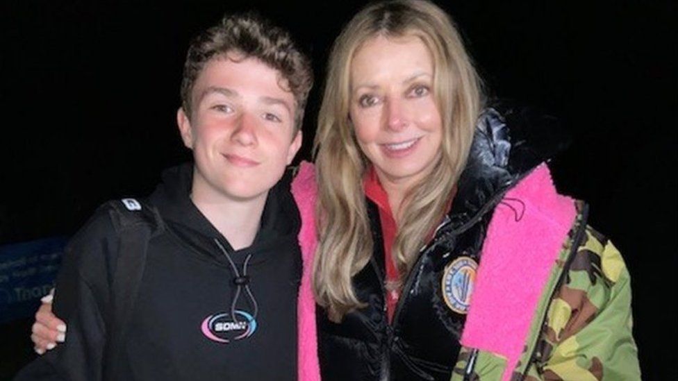 Max Woosey: Carol Vorderman in campsite singalong for charity - BBC News