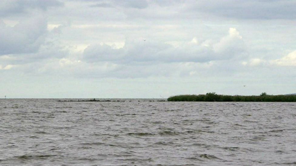 Two rescued from lough after dredger sinks - BBC News