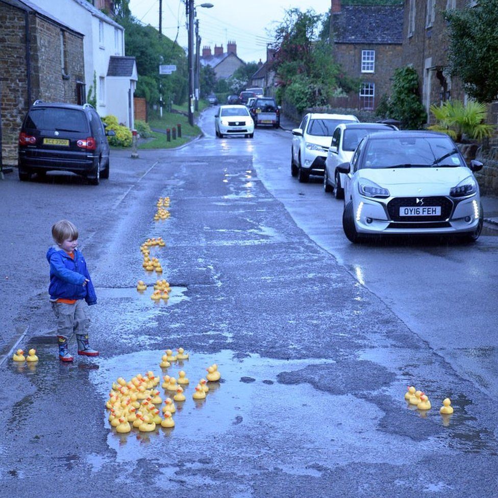 Rubber ducks swim in Steeple Aston village potholes - BBC News