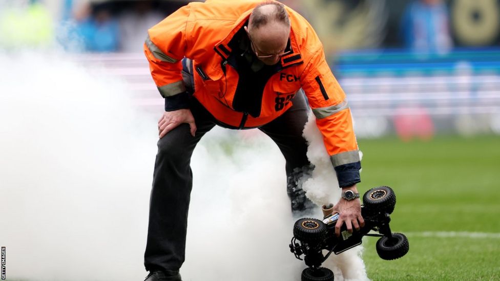 Bundesliga 2: Remote control cars with smoke bombs halt Hansa Rostock v ...