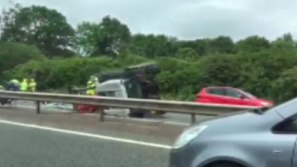 Overturned tractor on A55 in Denbighshire closes road - BBC News