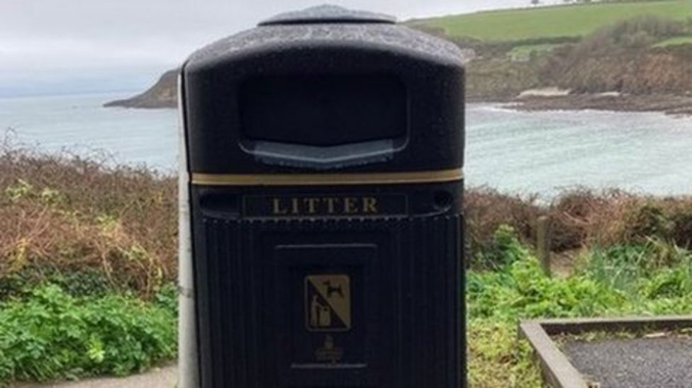 Falmouth coast path dog poo bin to be moved after complaints - BBC News