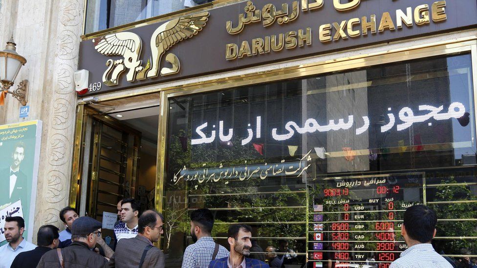 Iran sets single foreign exchange rate to rescue currency - BBC News