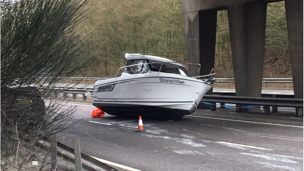 Boat falls from trailer on A12 near Colchester - BBC News