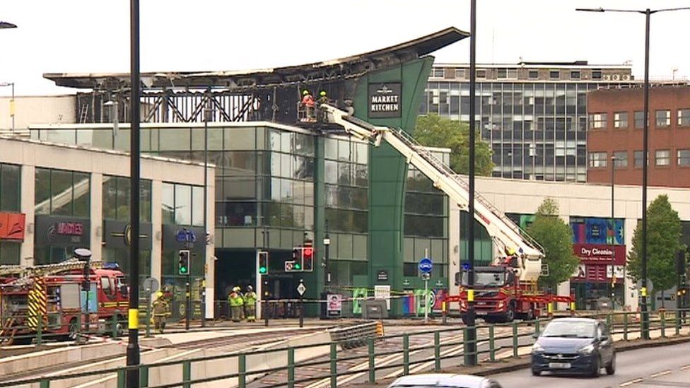Dozens of firefighters tackle Birmingham Morrisons roof blaze - BBC News