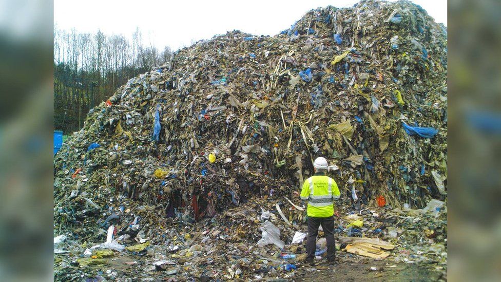 Mum and son sentenced over Huddersfield 'fire risk' waste site - BBC News