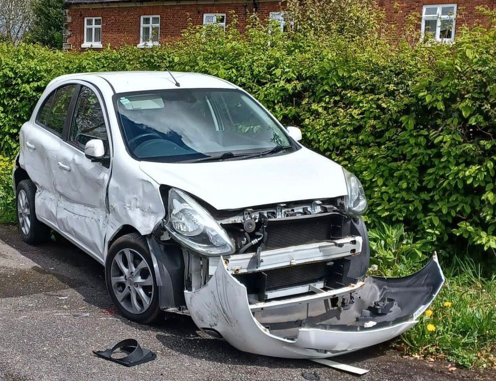 Stolen truck crashes into cars and house - BBC News