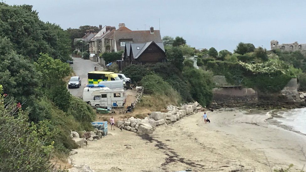 Row over man living in old ambulance in Castle Cove beach car park ...