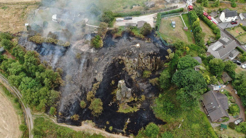 Mow Cop fire: Crews tackle 'out of control' beauty spot blaze - BBC News