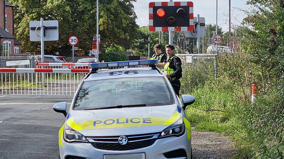 Nottinghamshire Police officer hit by train while helping man dies ...