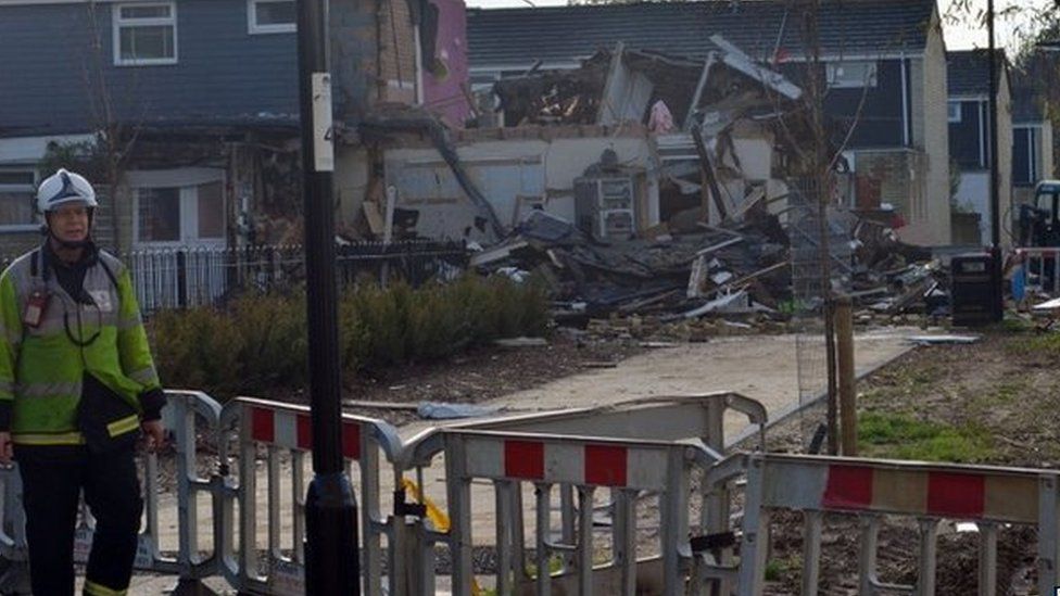 Gas explosion family return to rebuilt home - BBC News