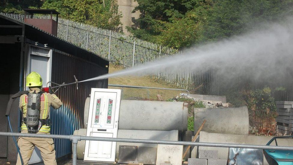 Llanarthne timber and tyre fire extinguished - BBC News