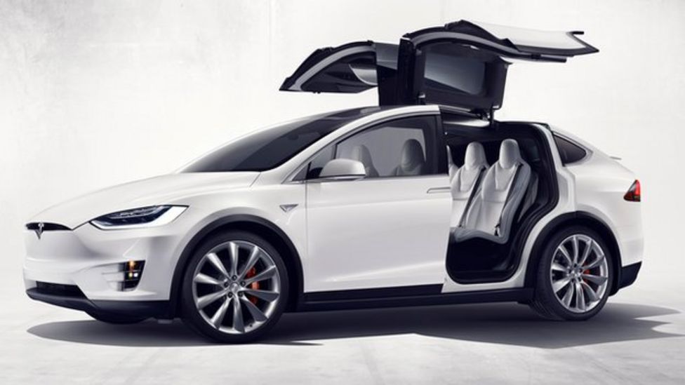 Tesla unveils Model X car with Falcon Wing doors - BBC News