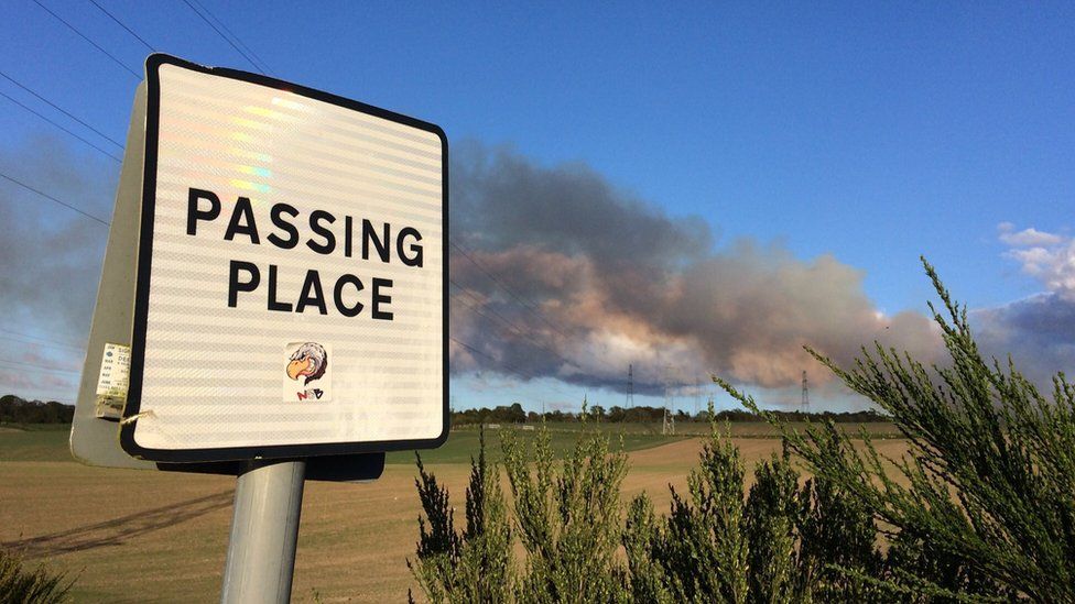 Fire crews bring wildfire near Inverness under control - BBC News
