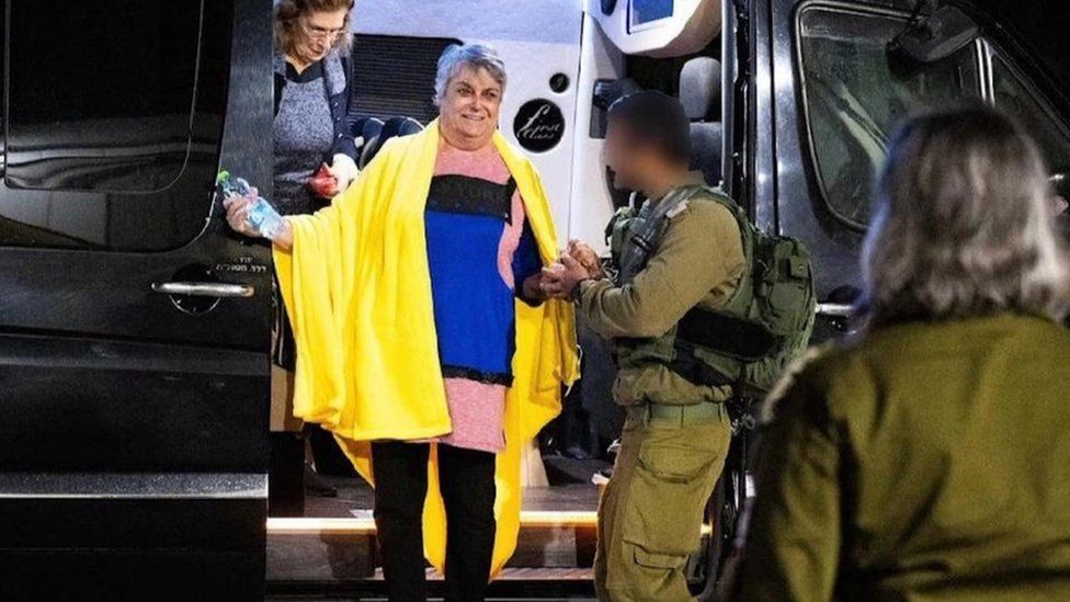 Son's 'sheer happiness' at hugging mother after Hamas release - BBC News