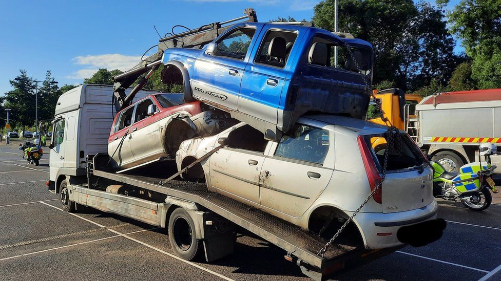 Vehicle carrier stopped by Norfolk Police for insecure load - BBC News