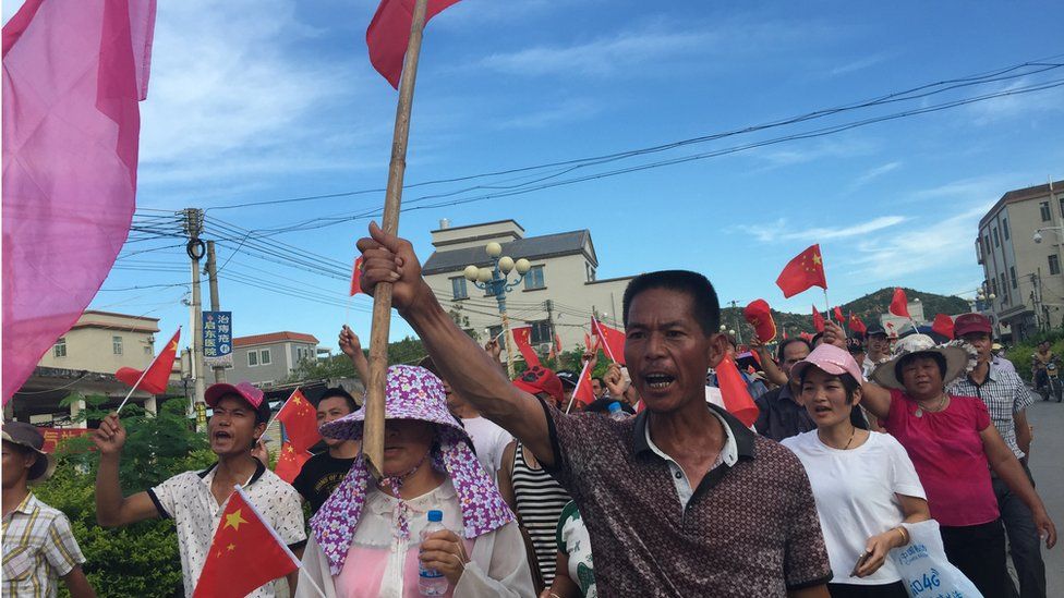 Wukan's 'rebel' villagers take to streets in ongoing protest - BBC News