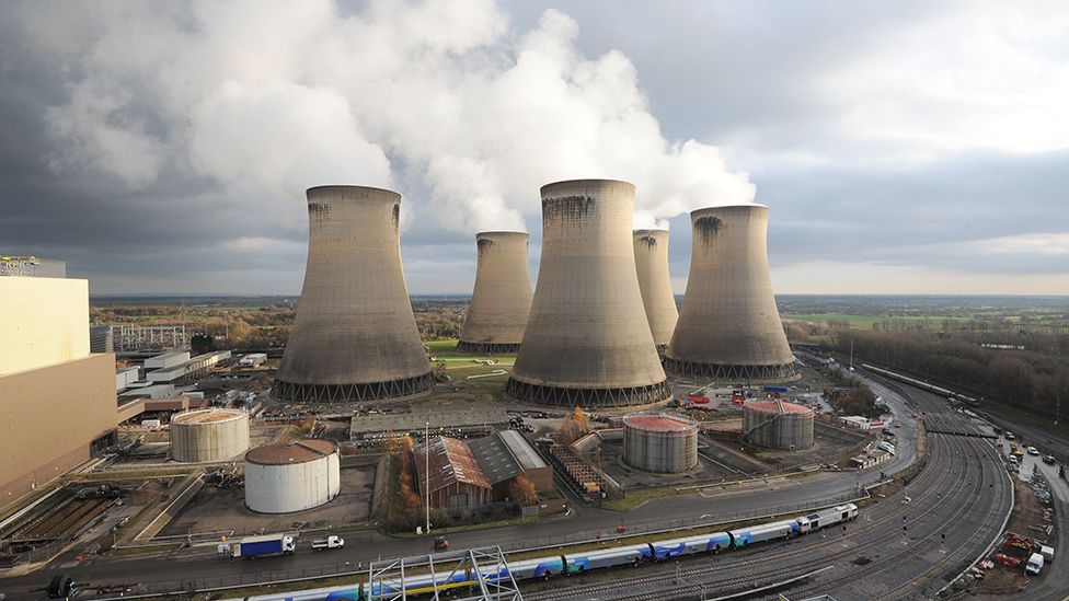 Protester climbs on top of train to Drax power station - BBC News