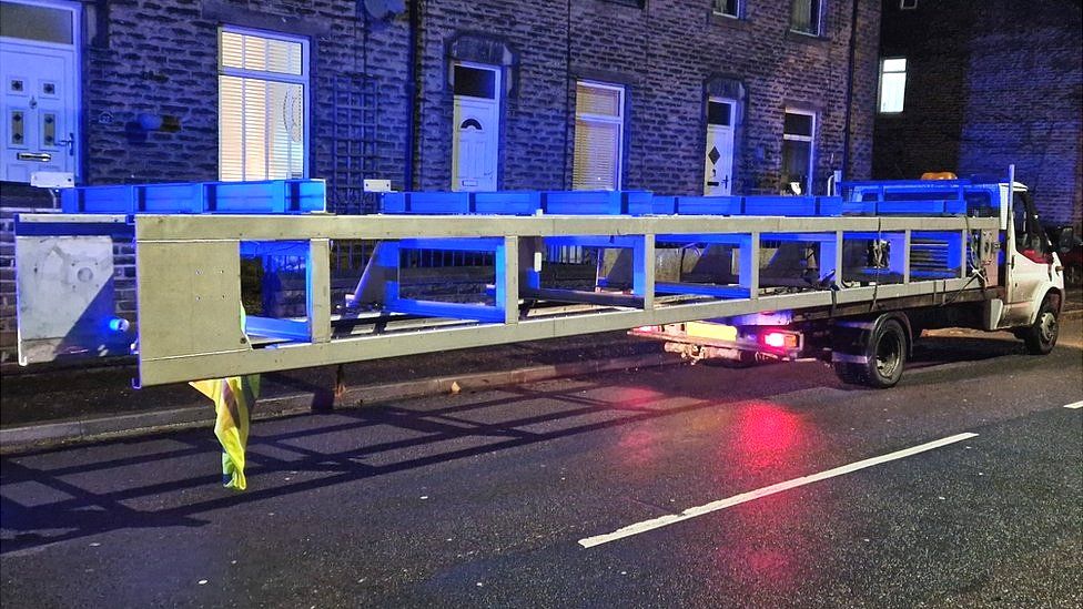 Elland: Police stop van carrying load twice as long as vehicle - BBC News