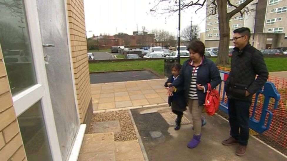 Gas explosion family return to rebuilt home - BBC News