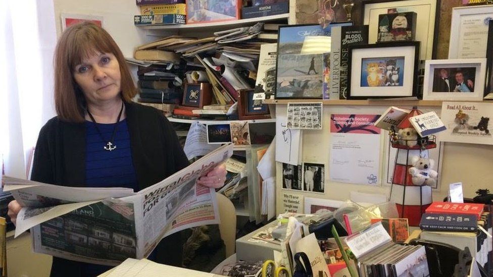 Wirral Council: Bookshop owner fined over sandwich wrapper - BBC News
