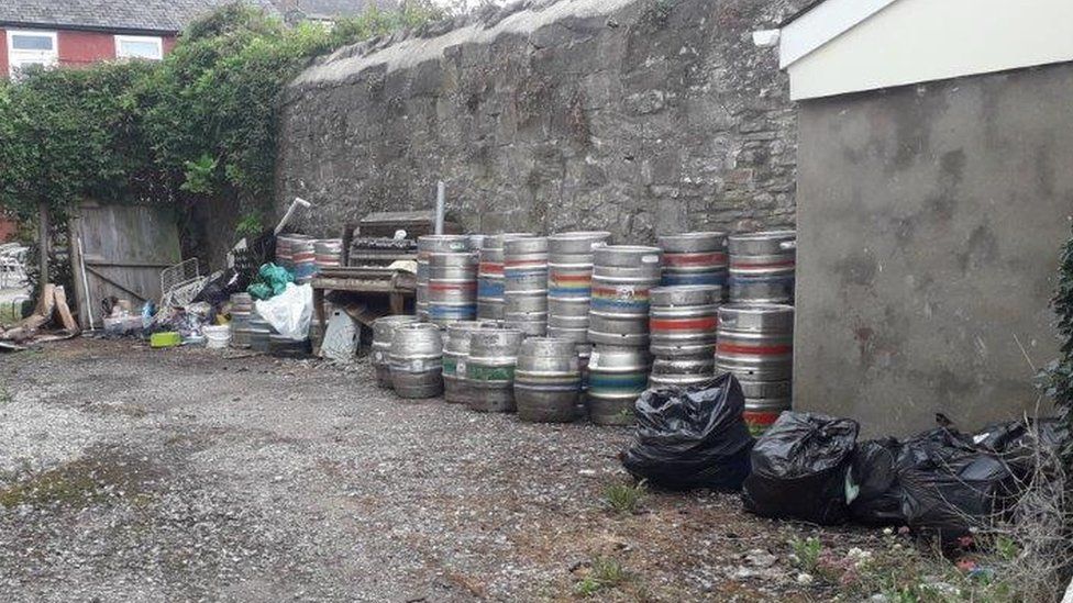 Britannia Inn Crickhowell pub fined for dumping waste in garden - BBC News