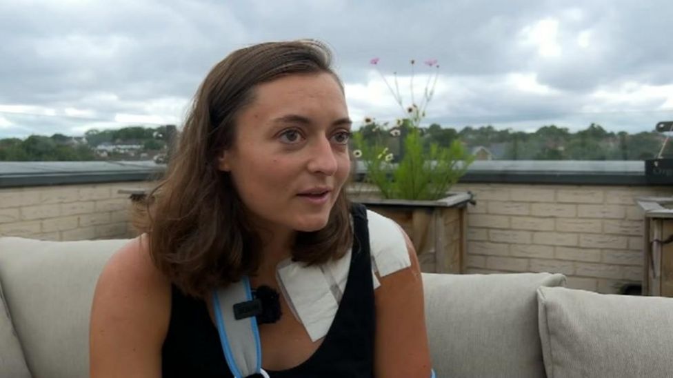 Triathlete vows to complete Ironman after assault in Kent - BBC News