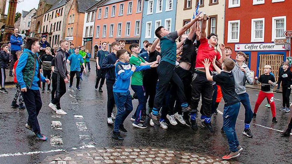 In pictures: Jedburgh ba' game takes to the streets - BBC News