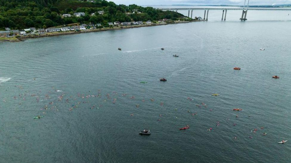In pictures: The Highlands' Kessock Ferry Swim - BBC News