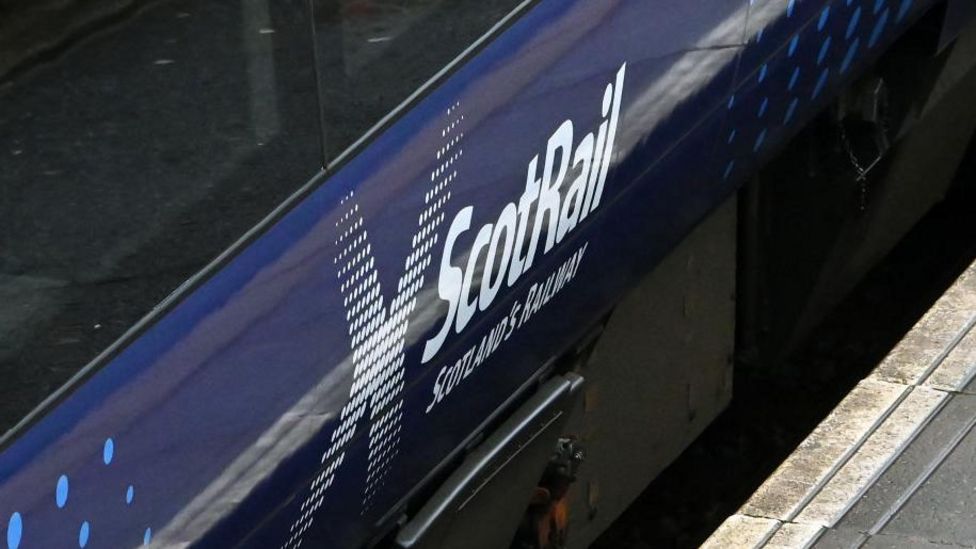 Car struck by train at level crossing near Inverness - BBC News