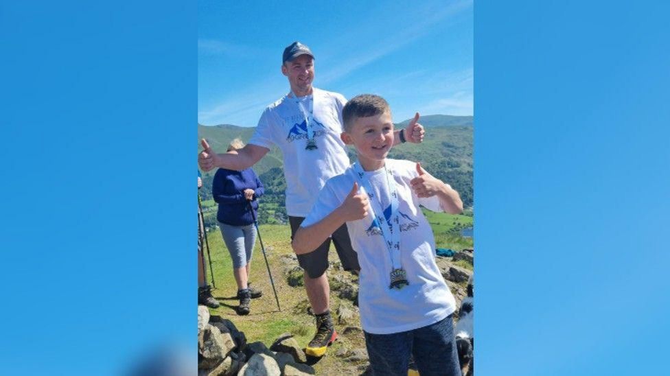 Boy with Tourette's completes Wainwright peaks - BBC News