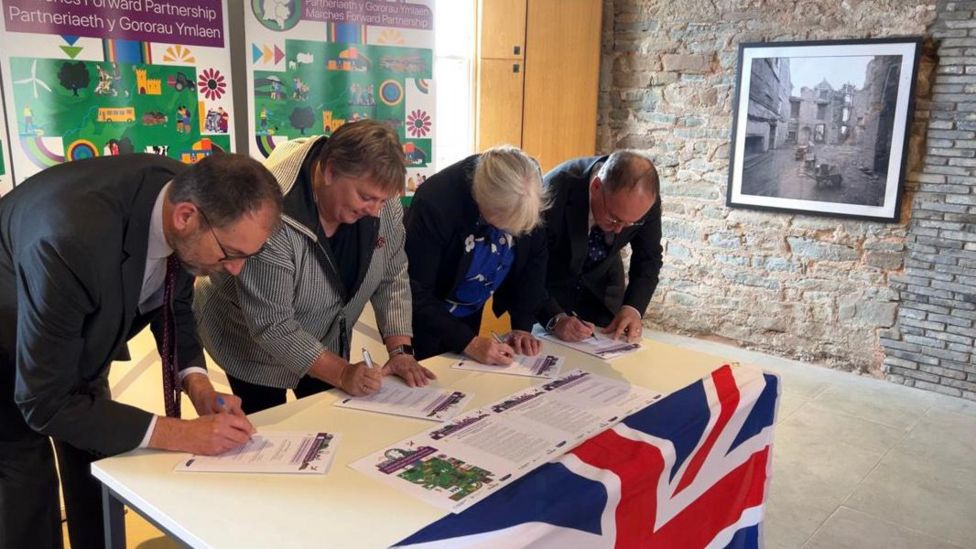 English and Welsh councils sign 'historic' cross-border deal - BBC News