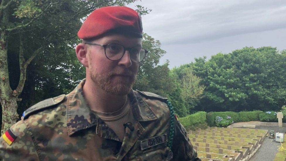 German soldiers carry out work on cemetery - BBC News