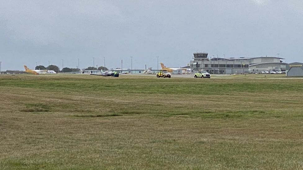 Airport runway temporarily closed after plane tyre bursts - BBC News