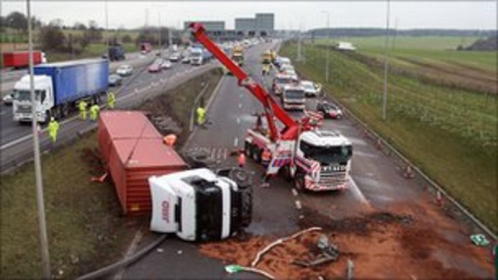 Lorry spill blocks M1 slip road and causes long delays - BBC News