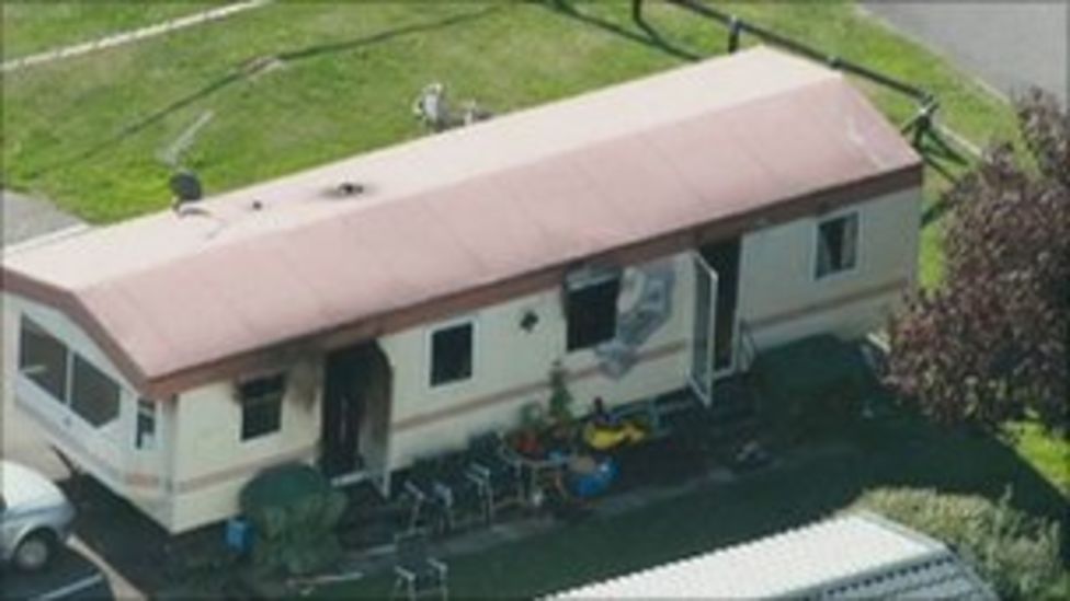 Couple named after Combe Haven fatal caravan fire - BBC News