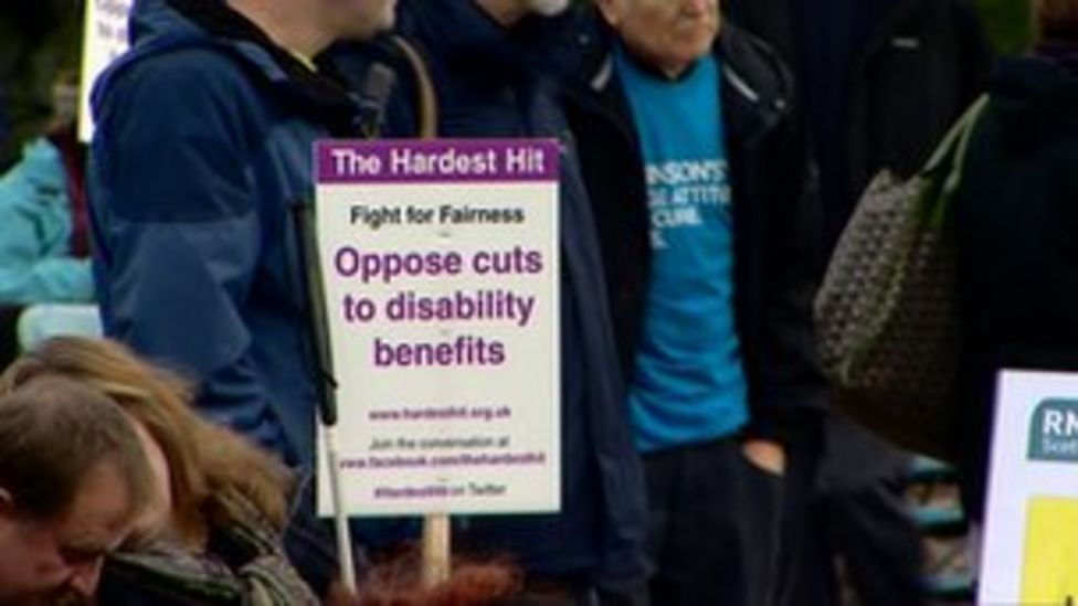 Disabled people protest in Edinburgh over benefit cuts - BBC News