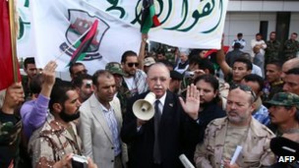 Gaddafi son's capture complicates struggle over cabinet - BBC News