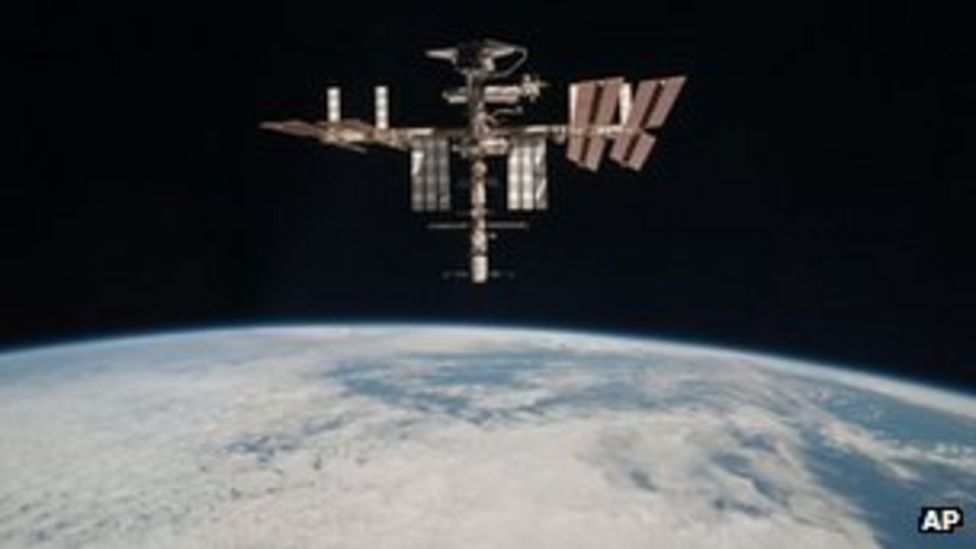 ISS crew take to escape capsules in space junk alert - BBC News