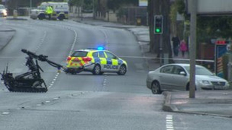Three men released in investigation into police car bomb - BBC News