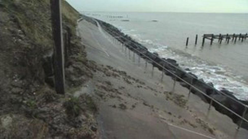 Cliff landslide blocks sea wall pathway at Corton - BBC News