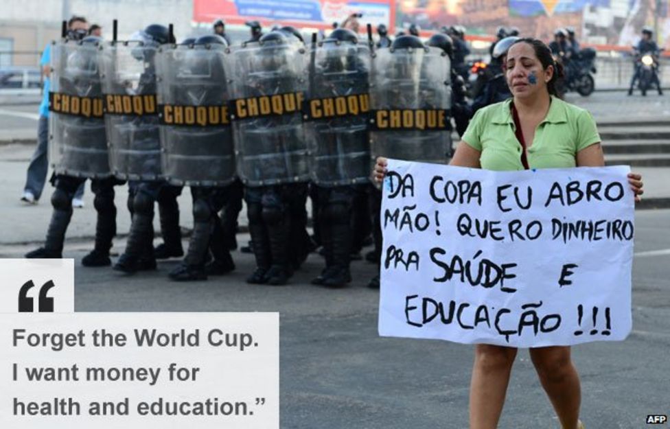 Brazil unrest: Protesters ‘subvert’ advertising slogans - BBC News